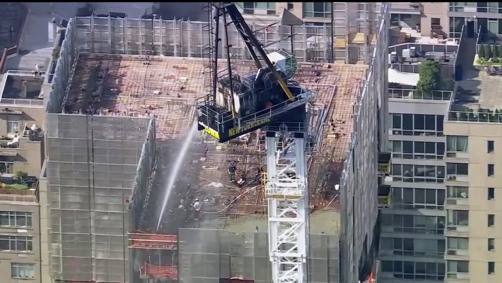 Fire on New York construction crane causes arm to collapse and hit a ...