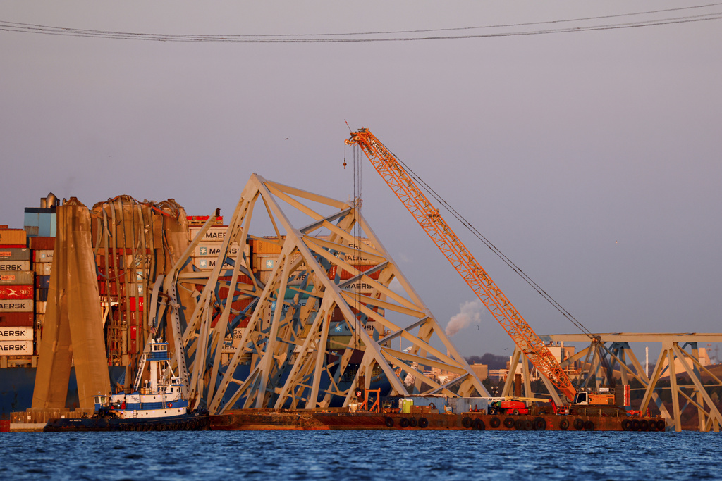 Crews carefully start removing first piece of twisted steel from ...
